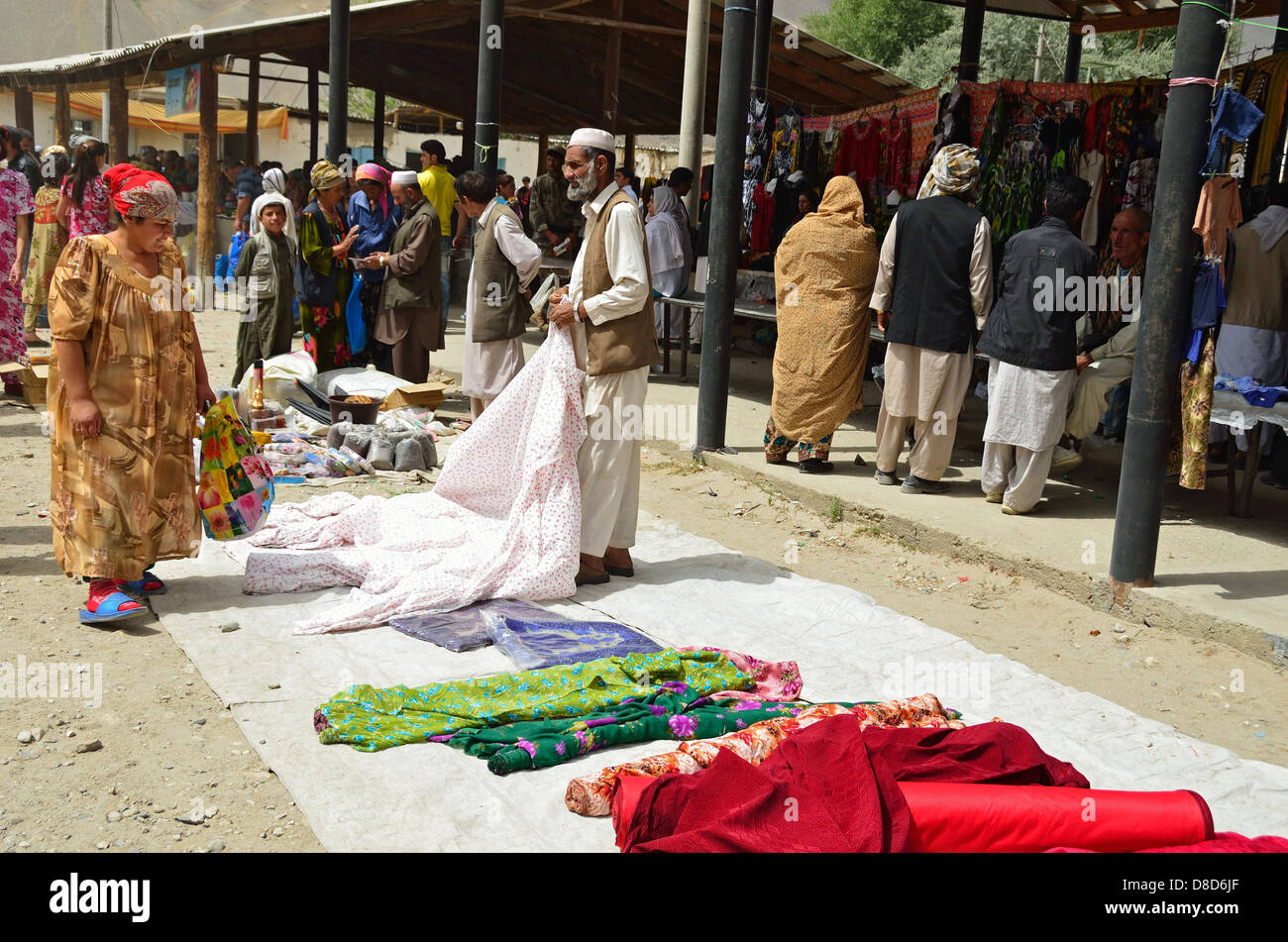 Man selling clothes at the Saturday market in Khorog Stock Photo - Alamy