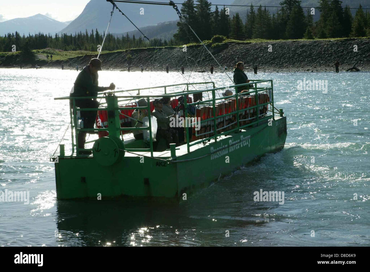 A river ferry boat transporting passengers across a waterway, commonly ...