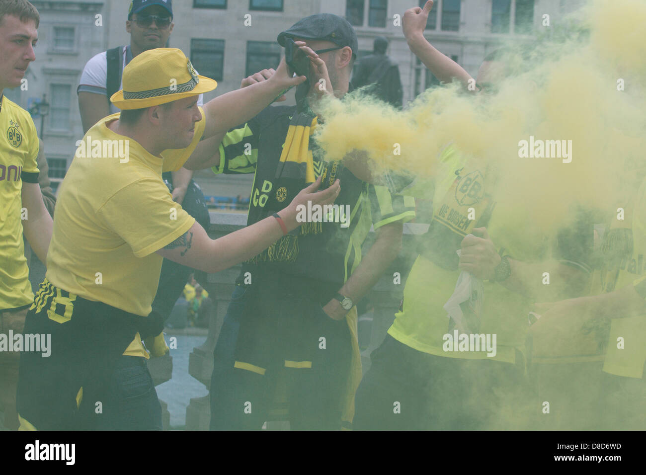 25th May 2013. London UK. Borussia Dortmund fans light yellow smoke ...