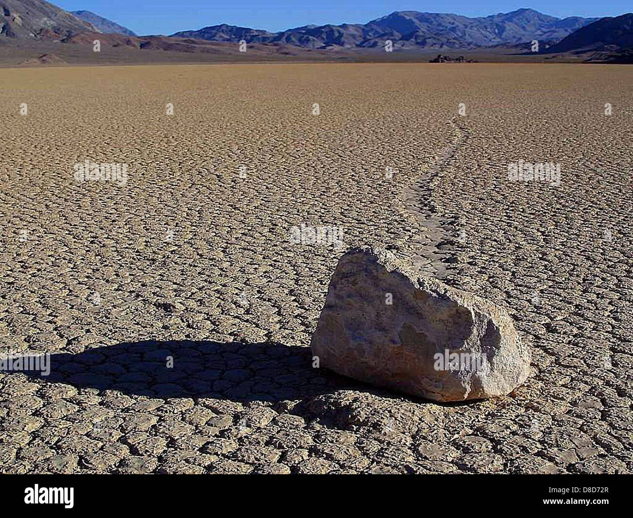 Rocks do indeed slide across the ground wind blowing Stock Photo - Alamy