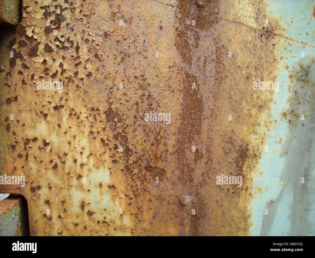 A close-up image showing rust developing on a metal surface, indicating ...