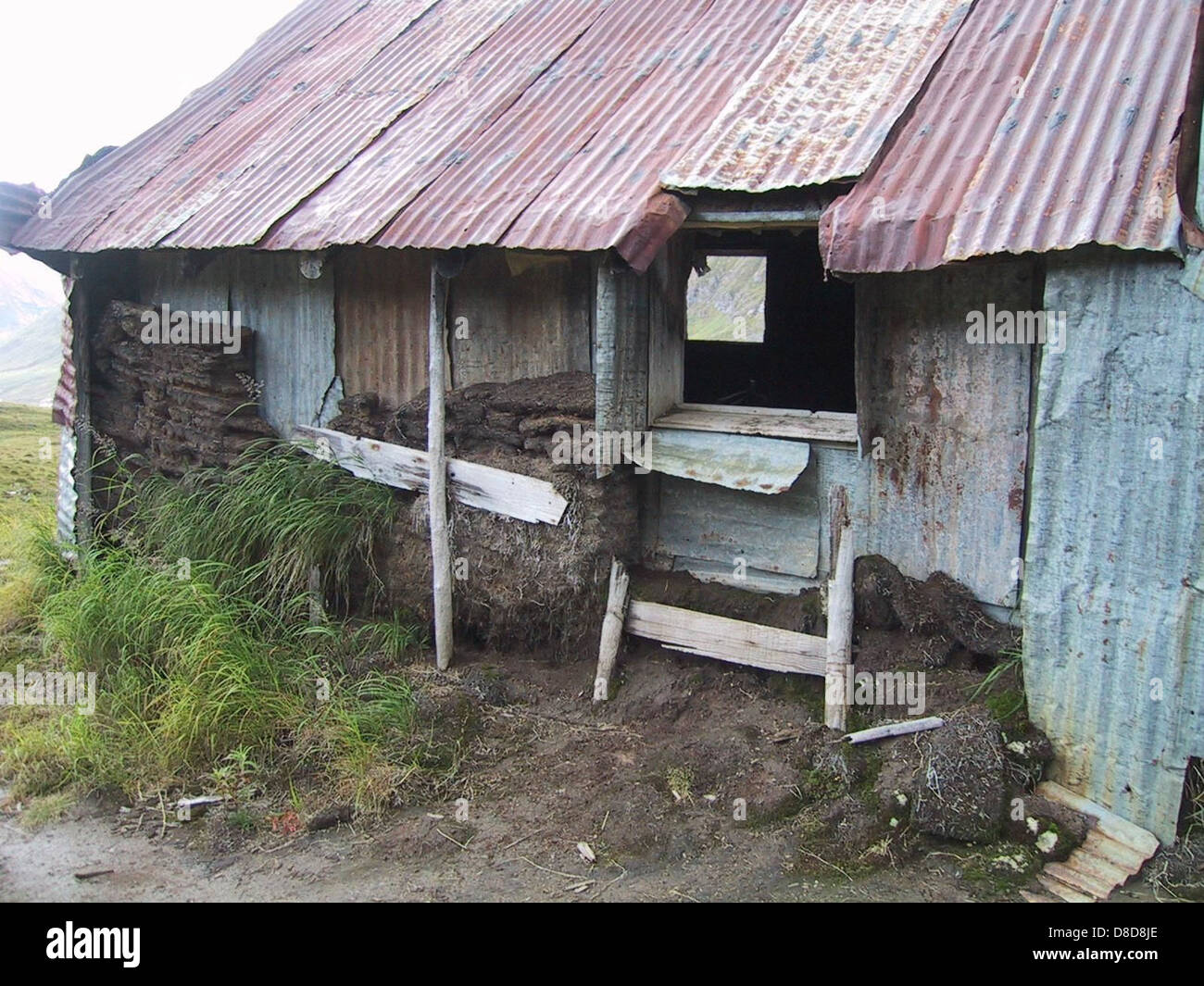 A small, rustic shack or house made of wood, possibly in a rural or ...
