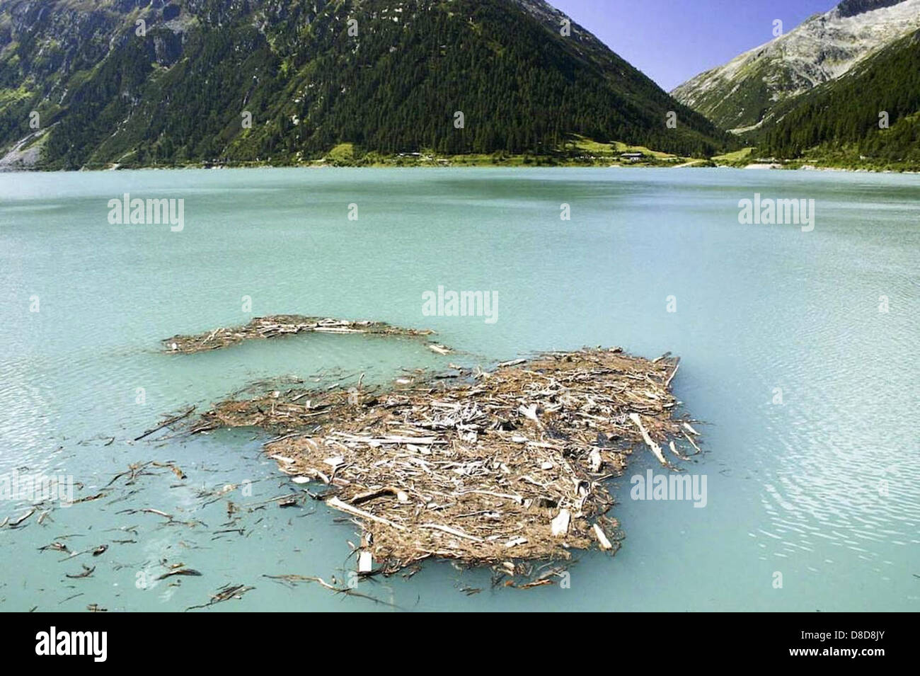 Shallow sea water with clear blue hues, revealing the sandy seabed ...