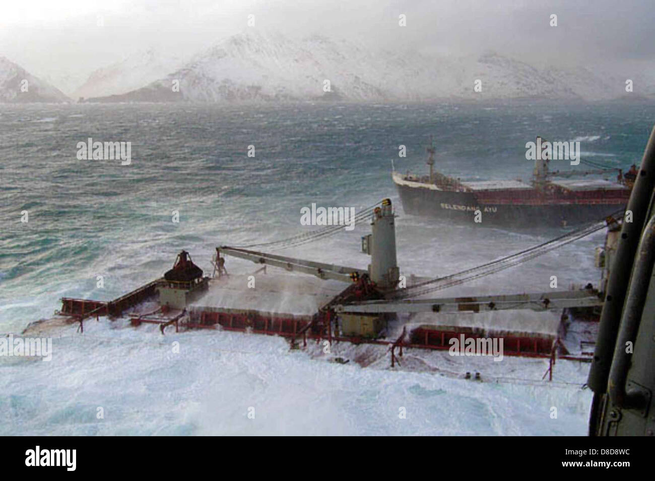 This image shows the remains of a shipwreck floating in the open sea ...
