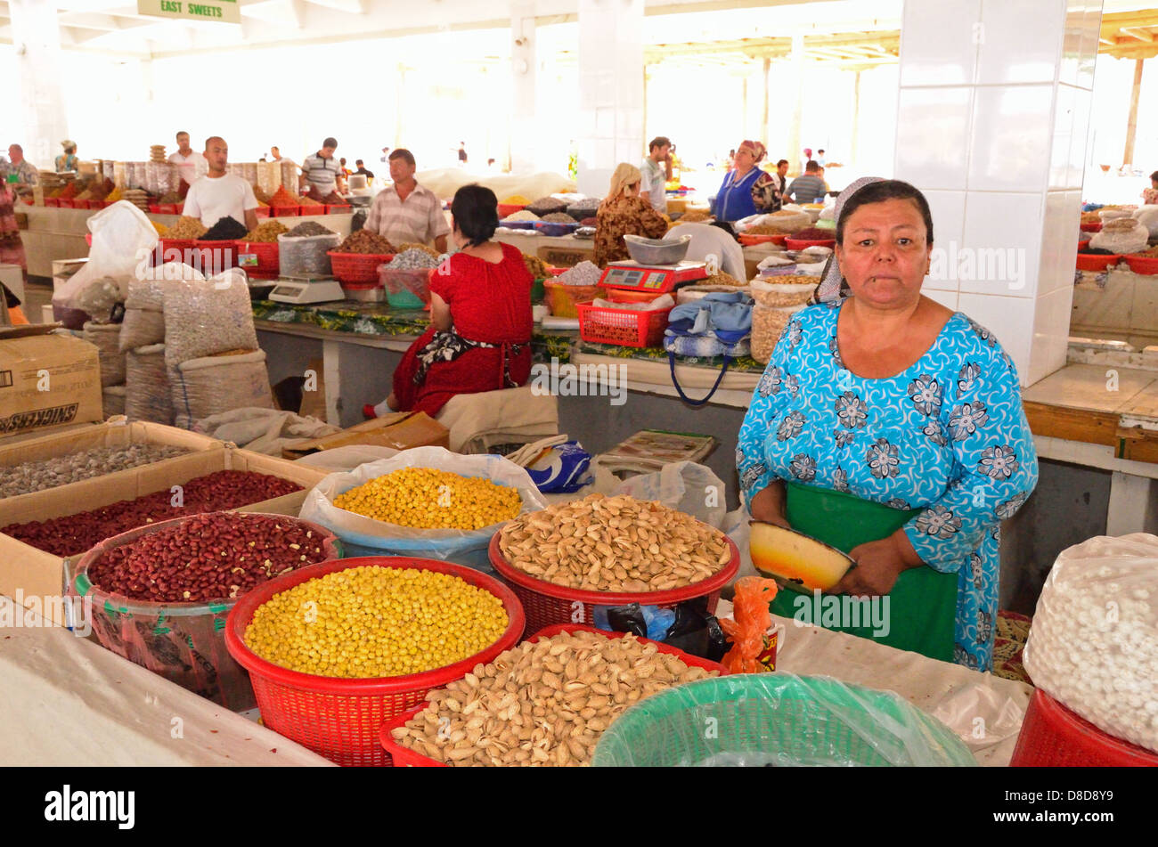 Woman selling corns and nuts at Siob Bazaar in Samarkand Stock Photo ...