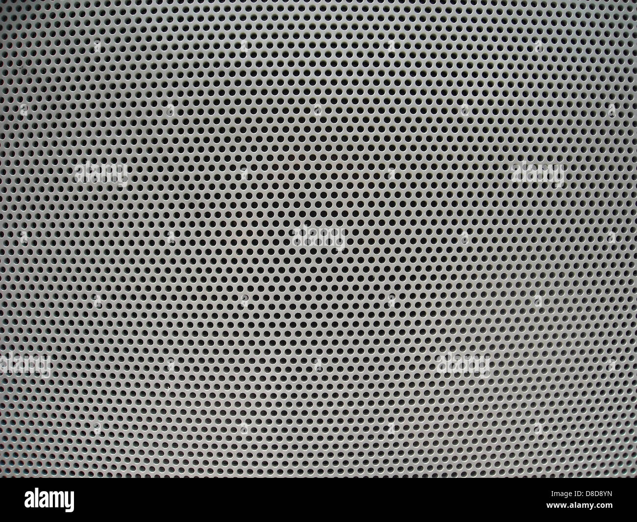A close-up of a metal sieve surface, showing its fine mesh designed to ...
