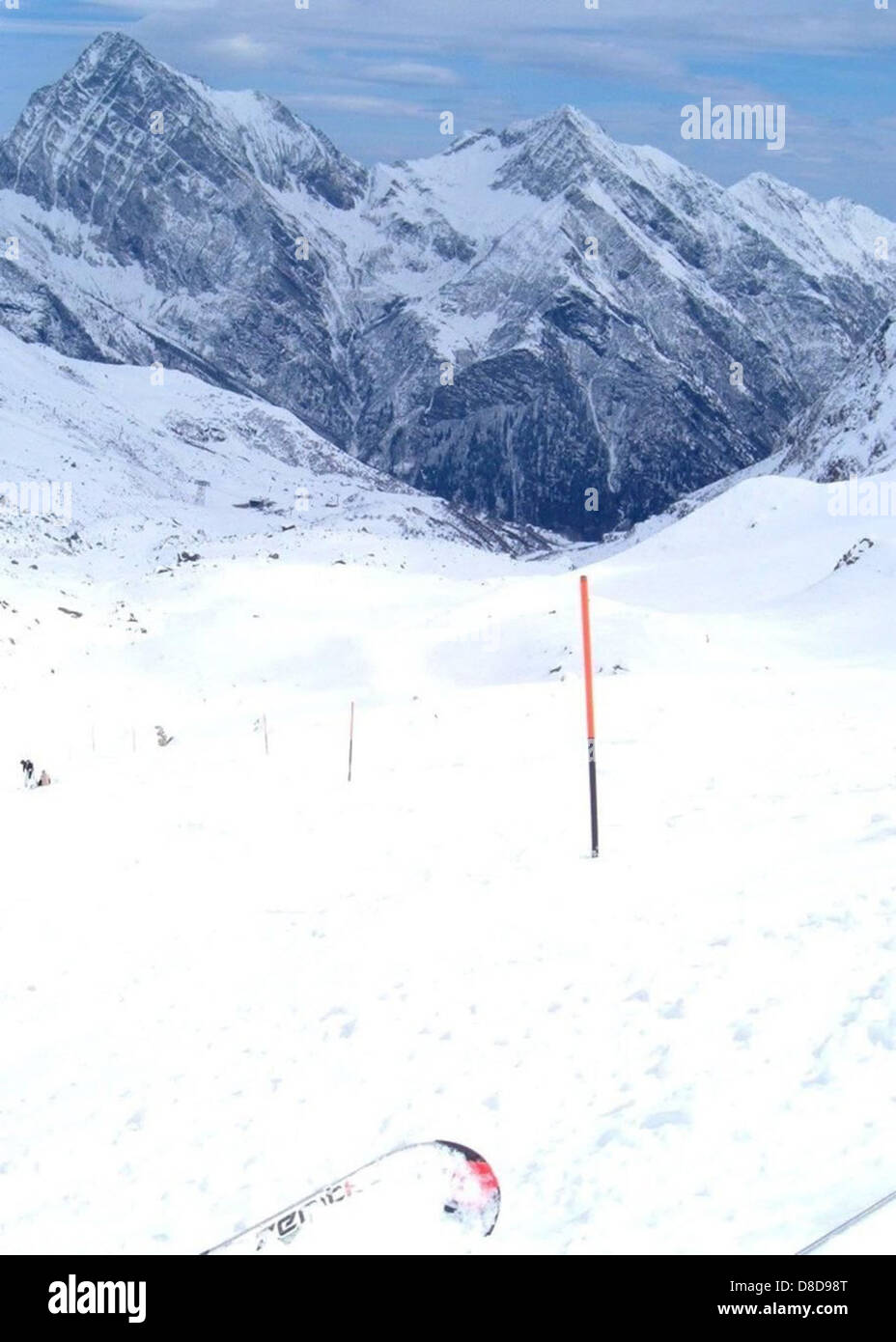 This image shows a skier descending the slopes of the Alps, a renowned ...
