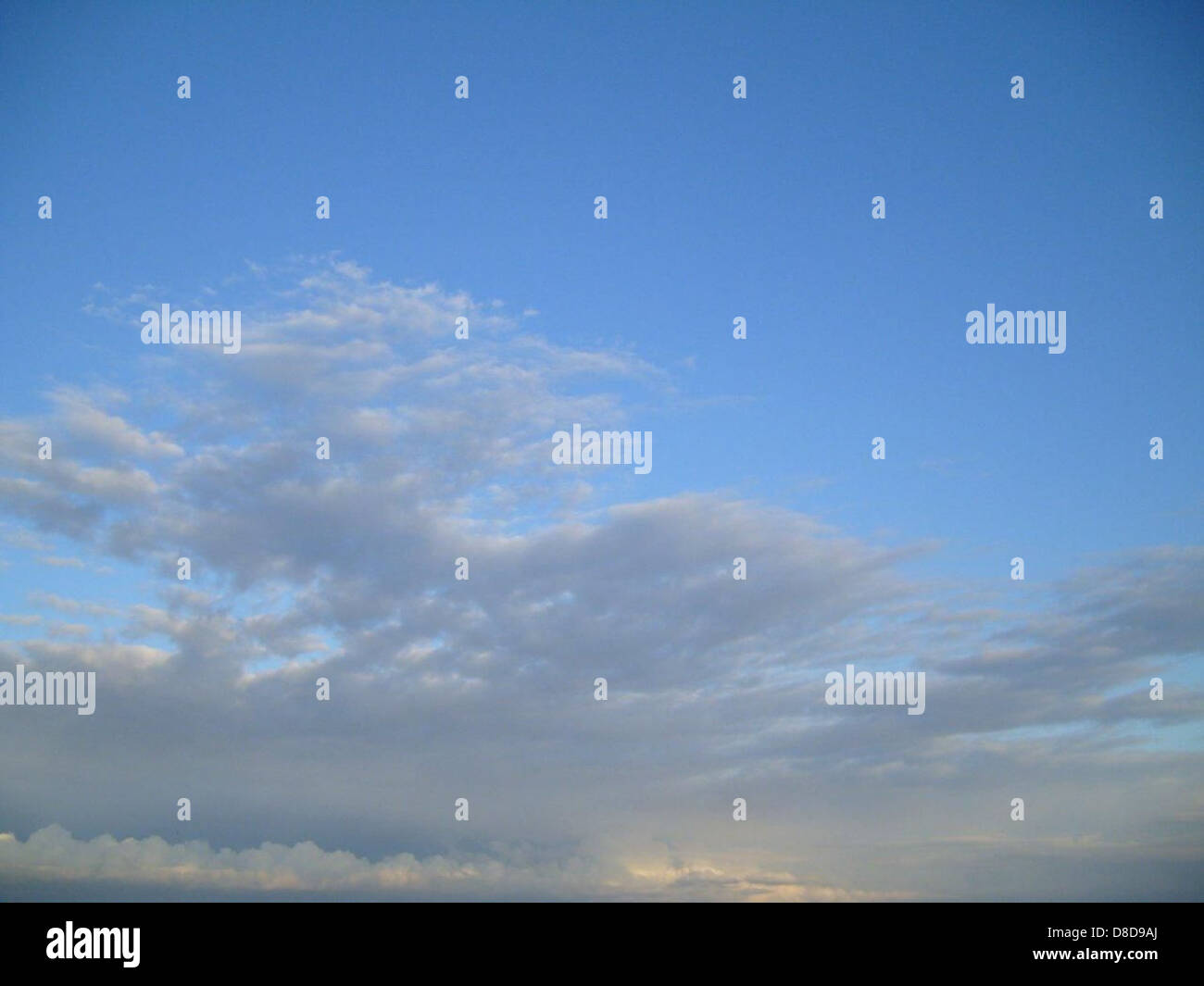 This stock photo features a sky partially covered with clouds. The ...