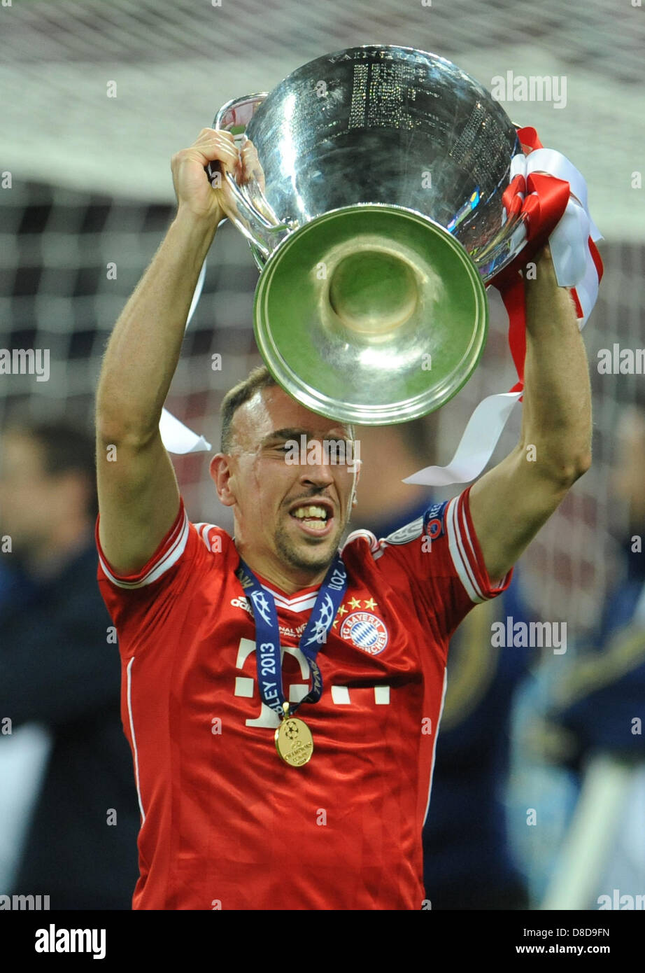 London, UK. 25th May, 2013. Munich's Franck Ribery lifts the trophy ...