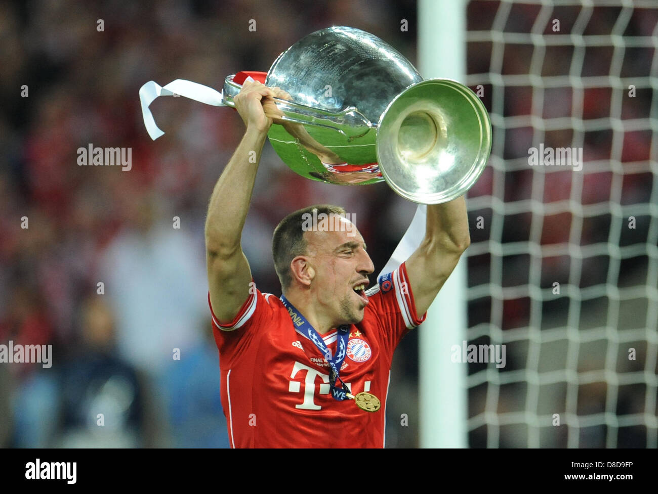 London, UK. 25th May, 2013. Munich's Franck Ribery lifts the trophy ...