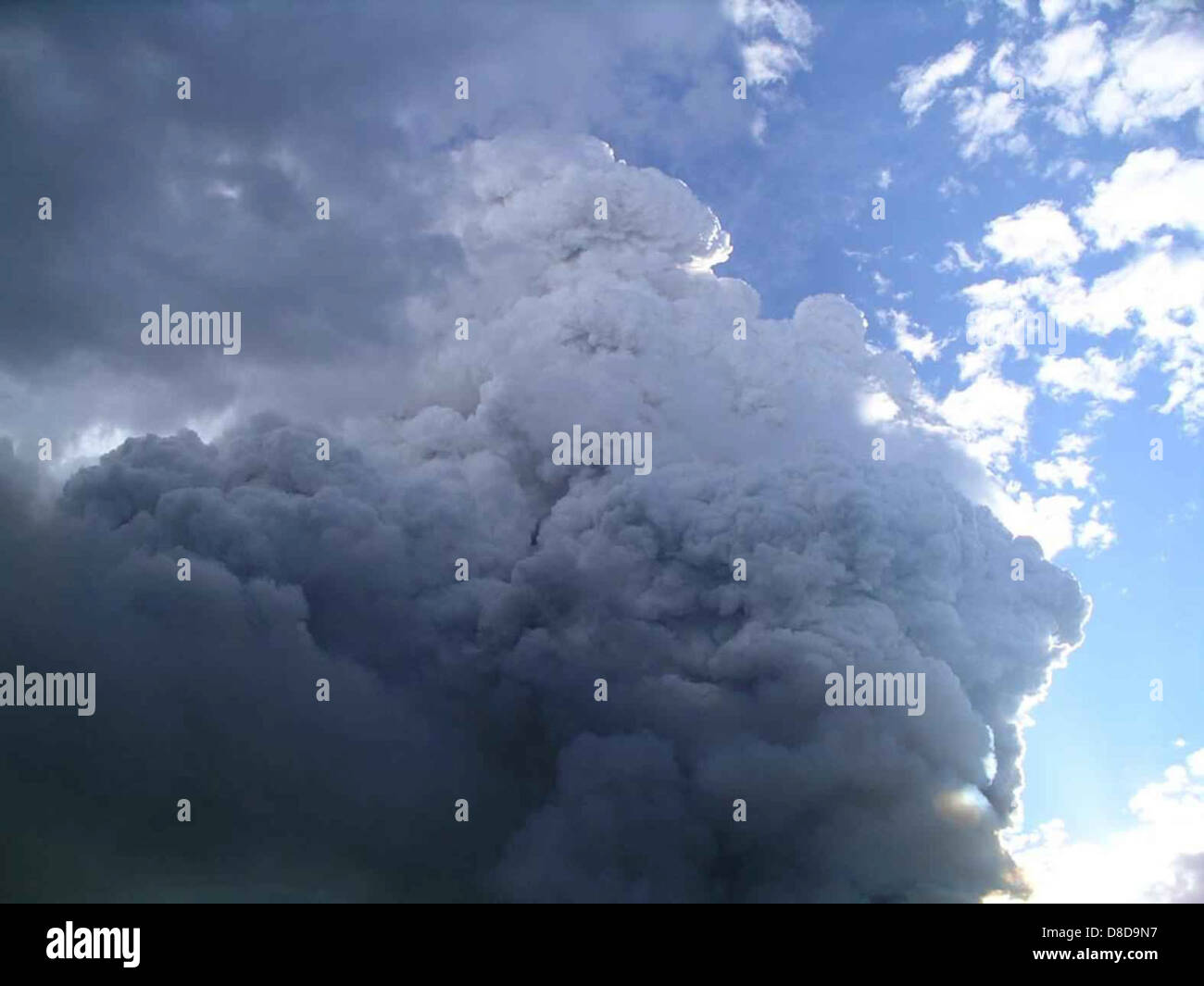 Smoke is seen rising in the air, creating a dynamic visual effect. The ...