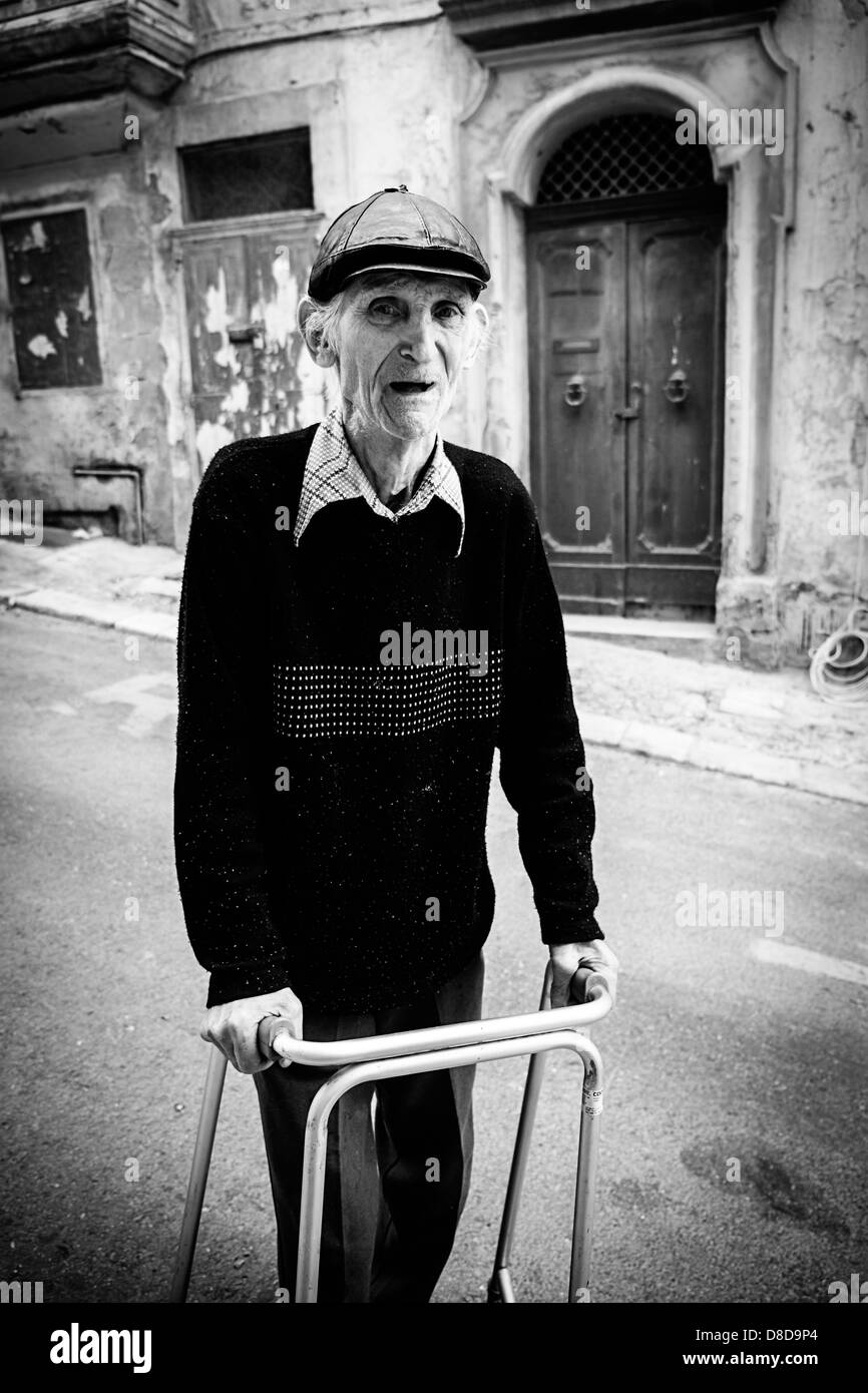 Elderly man using walking frame Black and White Stock Photos & Images ...