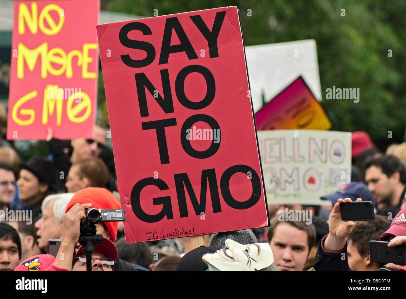 New York, NY, May 25, 2013. Signs in the crowd denounce genetically ...
