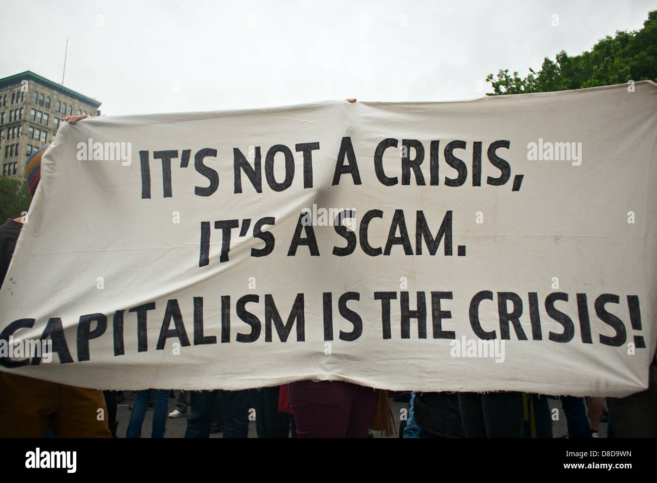 New York, NY, May 25, 2013. People held a large sign denouncing ...