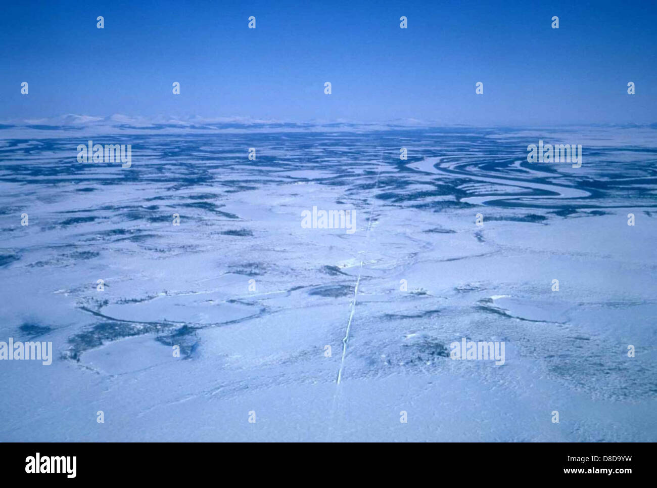 The image depicts a winter landscape covered in snow and ice, with a ...