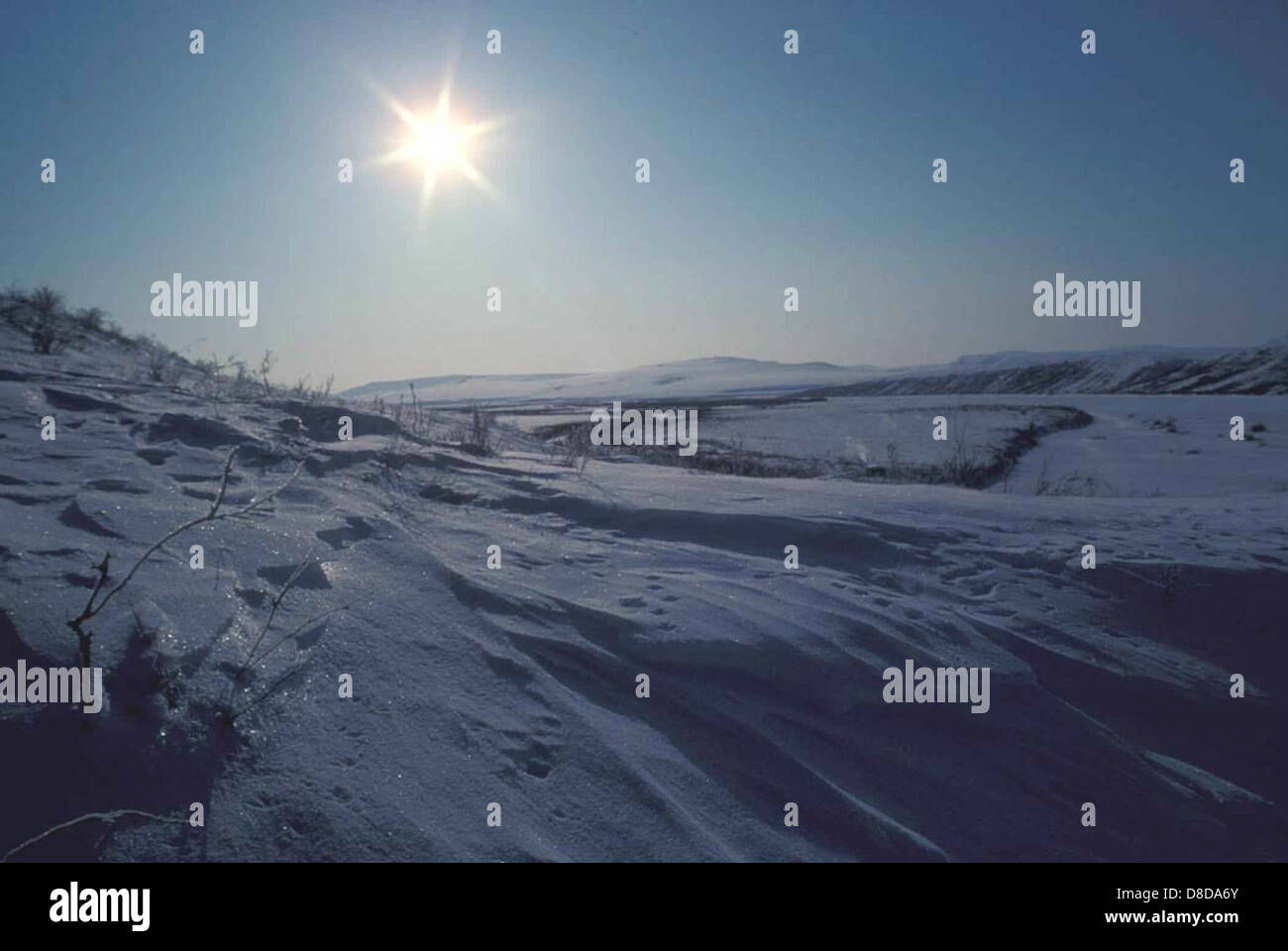 Snow scene with Sun Stock Photo - Alamy