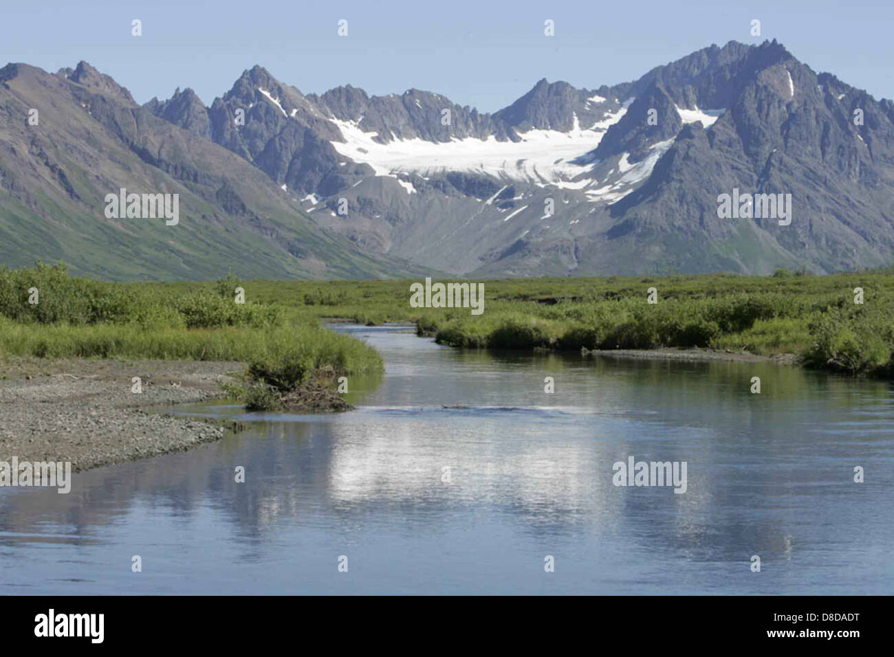 The image captures the early spring season in the mountains, where snow ...