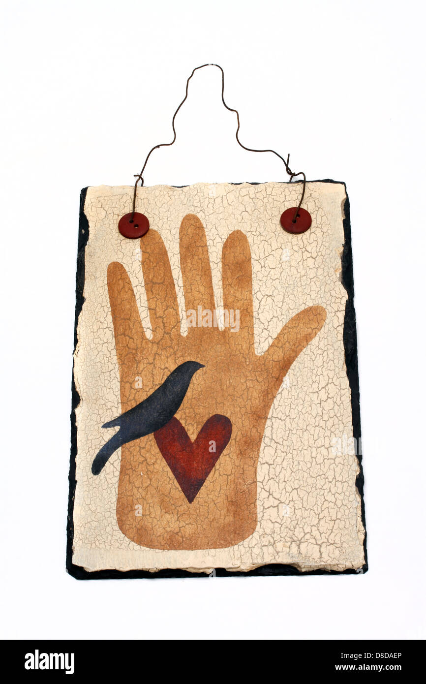 Quaker symbols dove heart hand on a plaque Stock Photo - Alamy