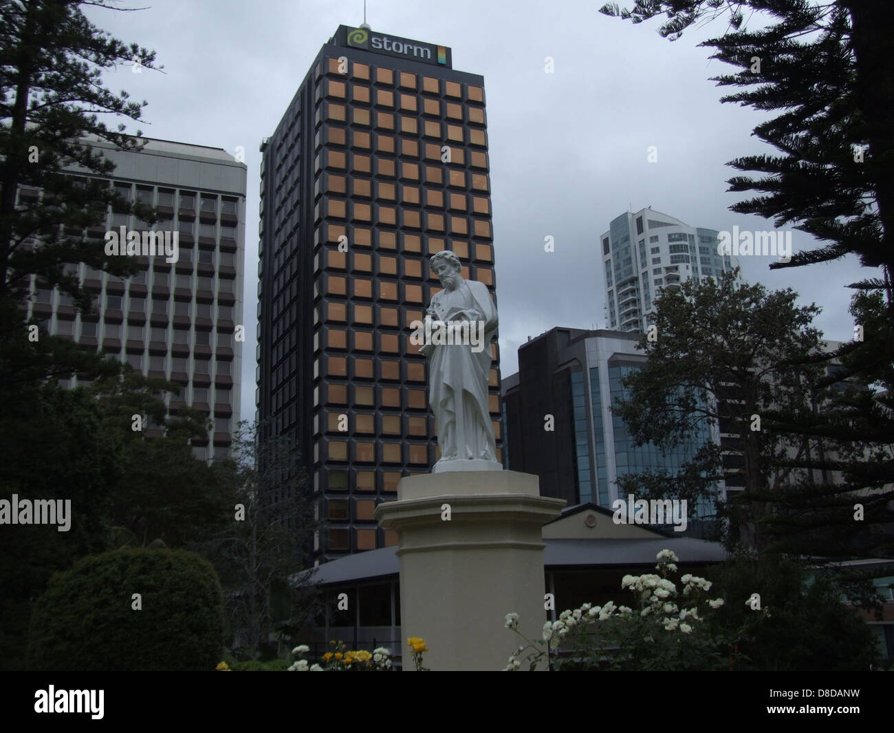 A statue located in a park, surrounded by greenery and open space. The ...