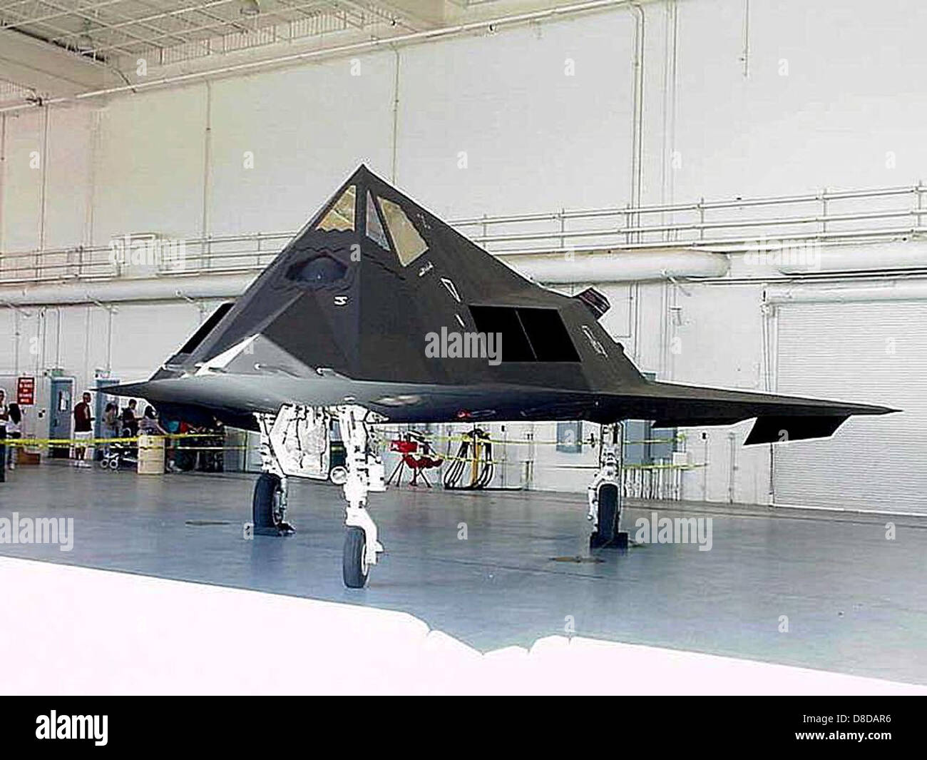 A stealth fighter aircraft, captured in mid-flight, demonstrating its ...