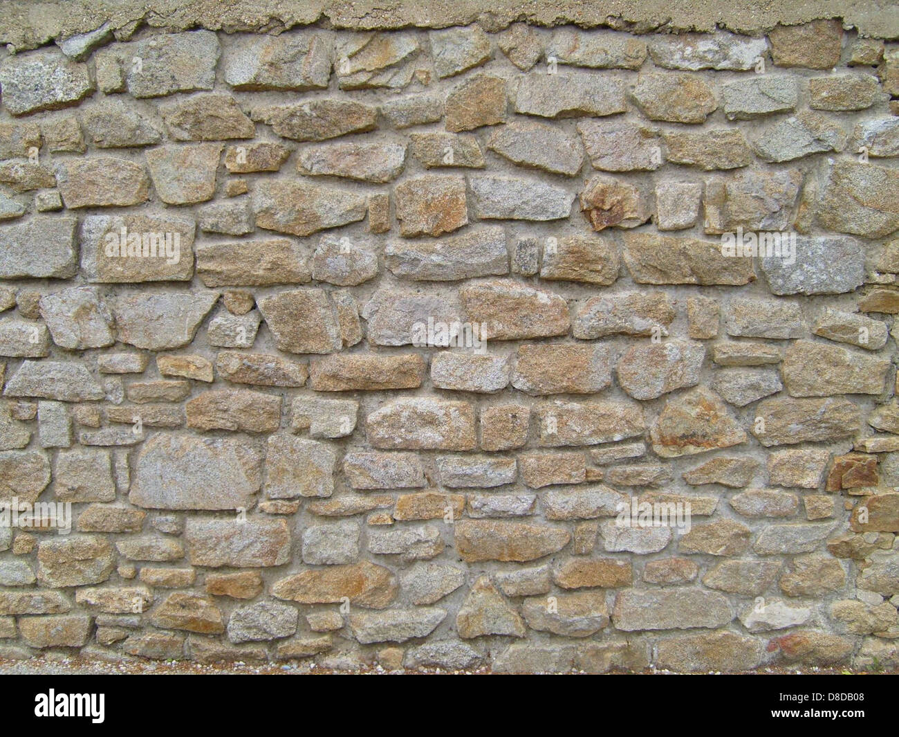 The stone wall pattern displays a combination of different stone sizes ...