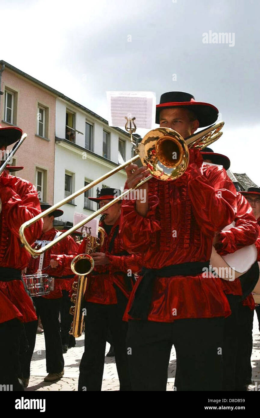 This image captures a vibrant street performance during a parade, with ...