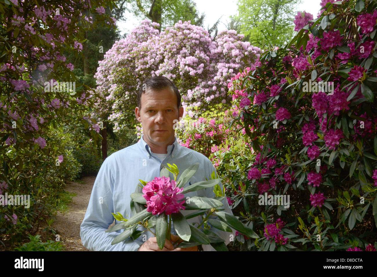 Forest ranger Klaus Weinem poses for the camera with blooming ...
