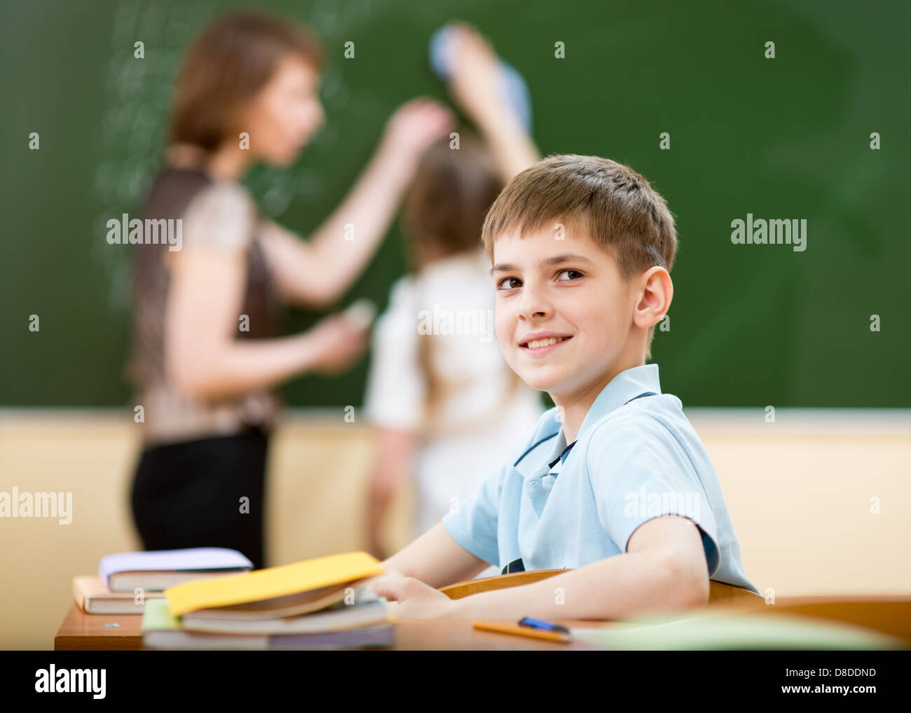 School boy in classroom at lesson Stock Photo - Alamy