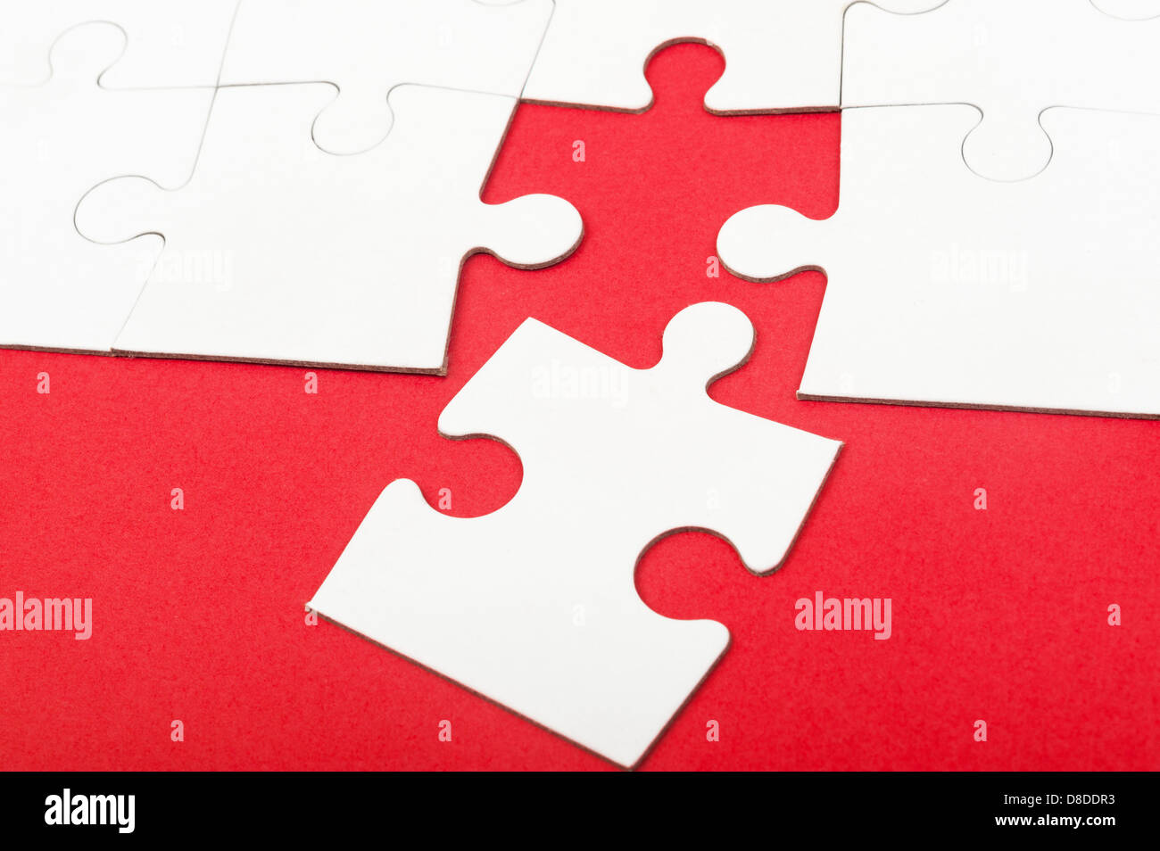 Group of white paper jigsaw puzzles Stock Photo - Alamy