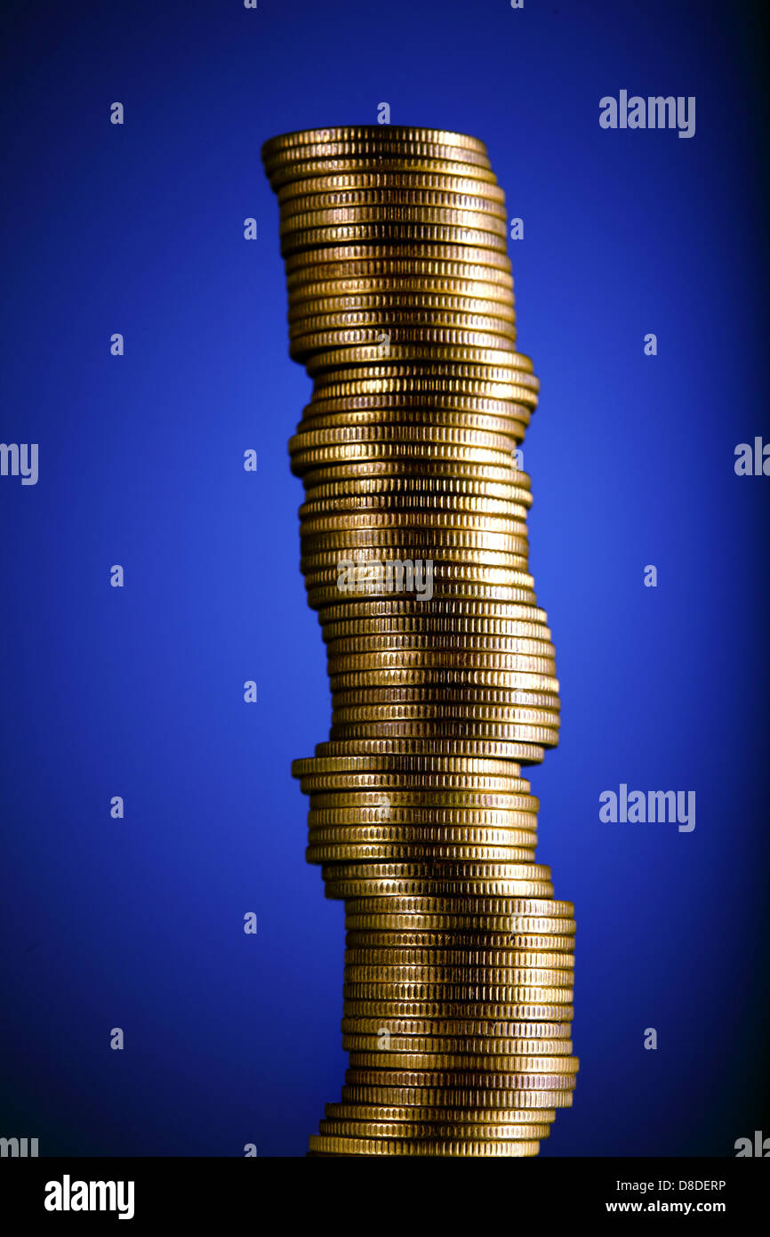 golden coins on blue background Stock Photo - Alamy