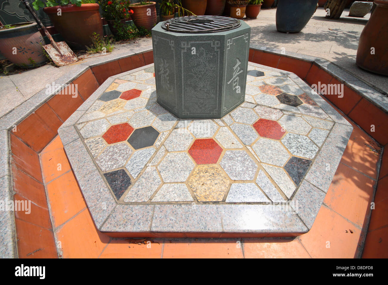 Octagon shape ground well Stock Photo - Alamy