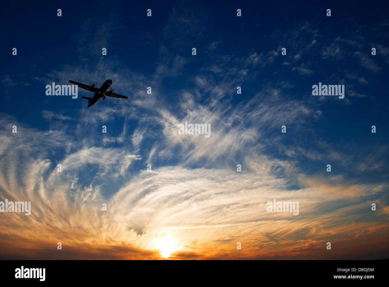 Sunset and airplane Stock Photo - Alamy