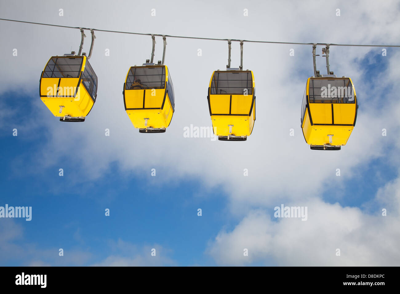Row of cable cars in the sky Stock Photo - Alamy