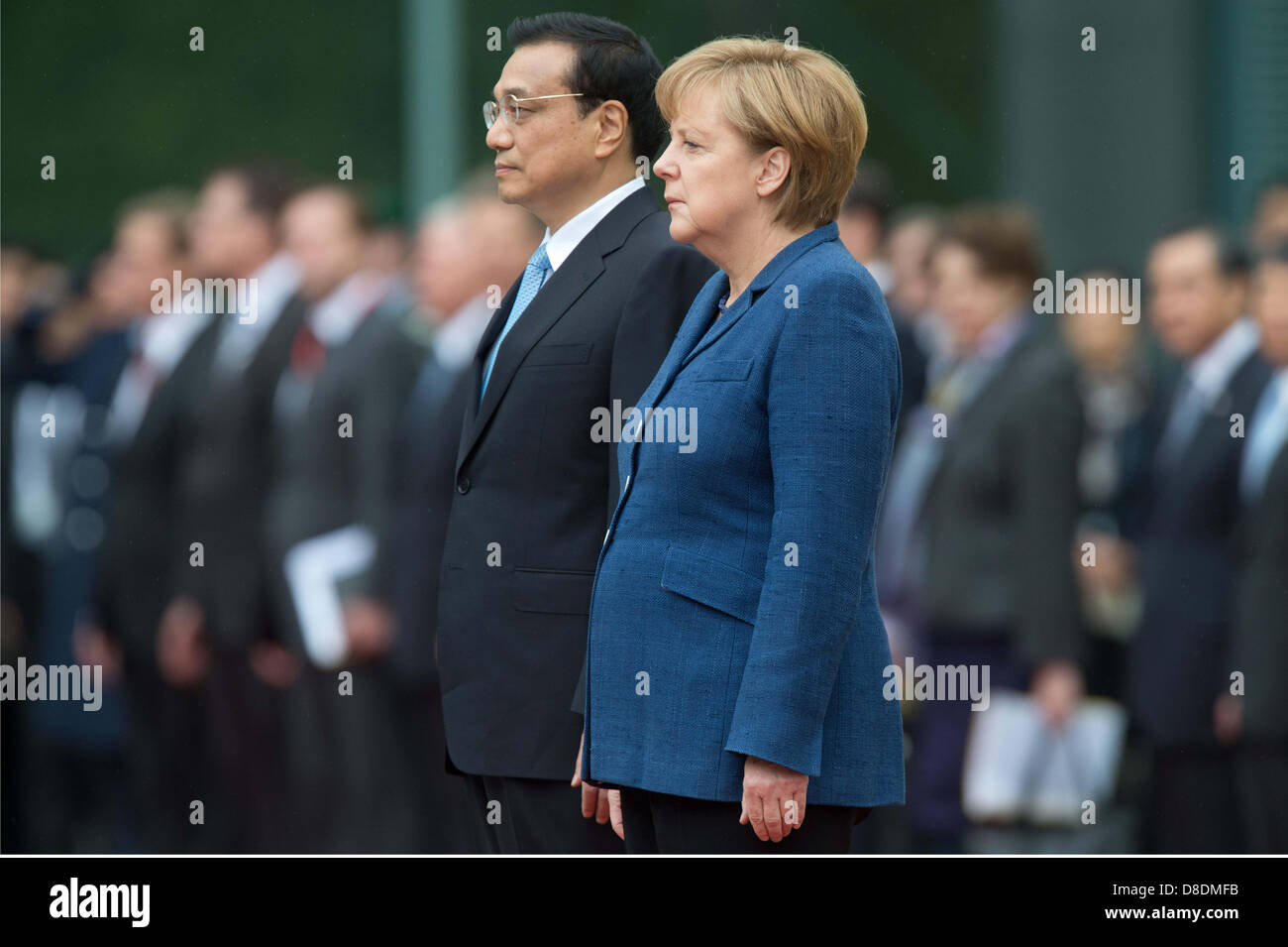 New Premier of China Li Keqiang (L) is welcomed by German Chancellor ...