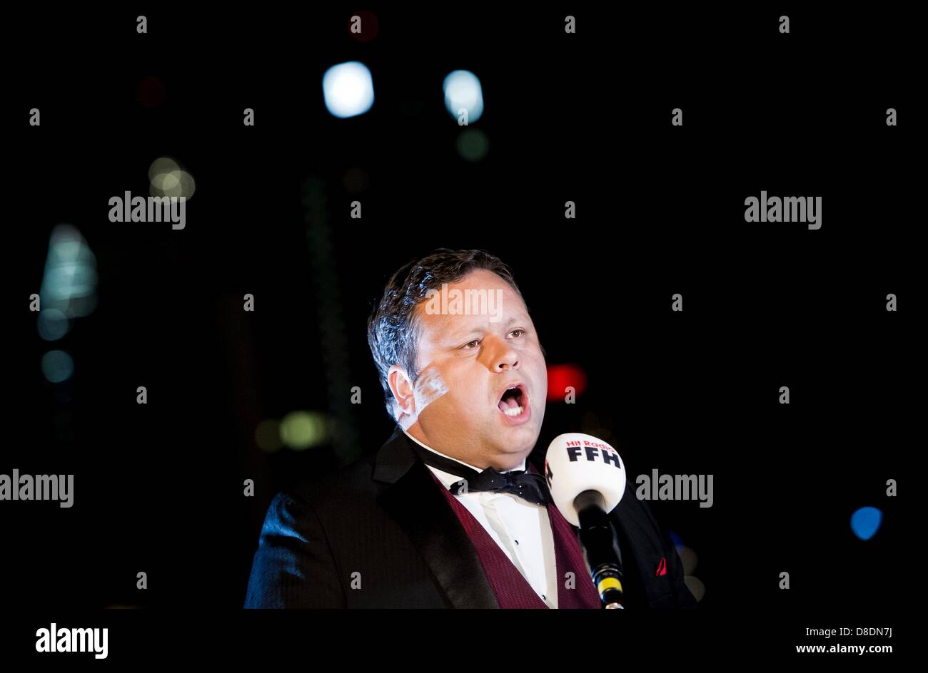 Opera singer Paul Potts sings before the fireworks display on the first ...