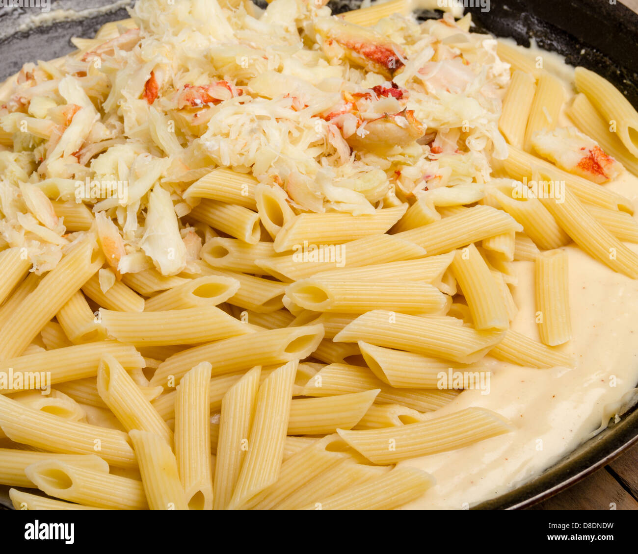 Pan of Dungeness Crab and Parmesan macroni and cheese on the stove ...