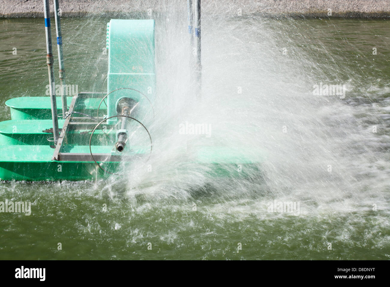 Aerator spinning on water surface oxygen blenders water treatment Stock ...