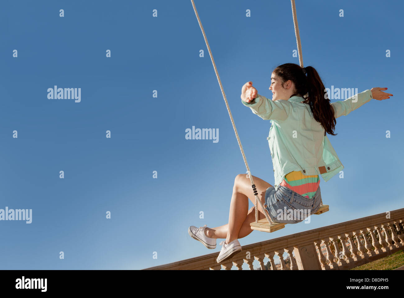 teen freedom, girl on swing in summer Stock Photo - Alamy