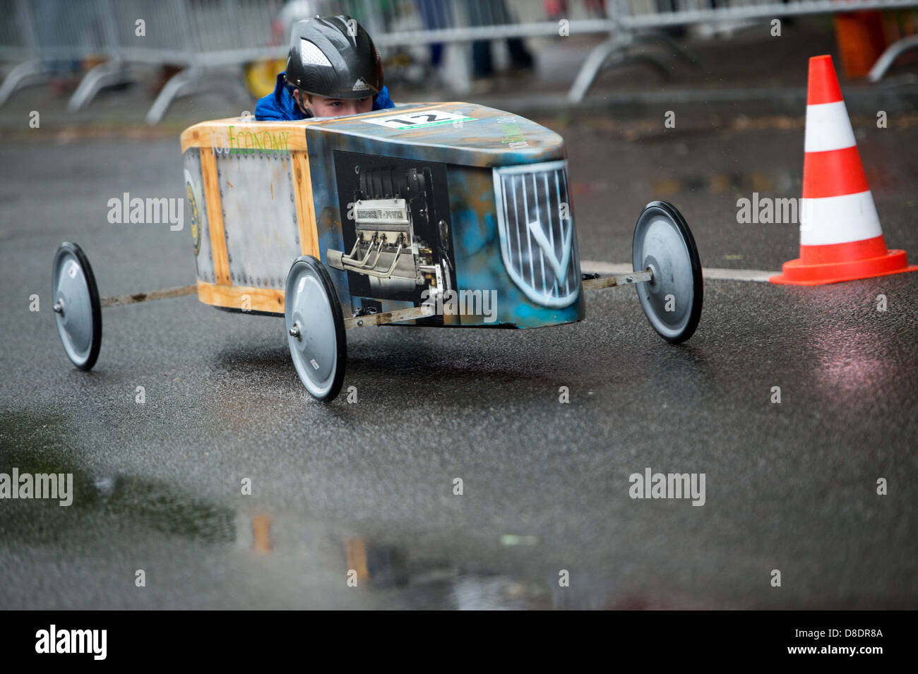 Berlin, Germany. 26th May 2013. A child drives a soap box race car in ...