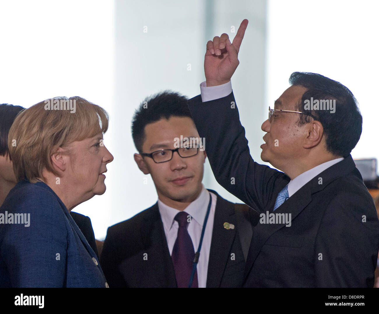 German Chancellor Angela Merkel (L) and new Premier of China Li Keqiang ...