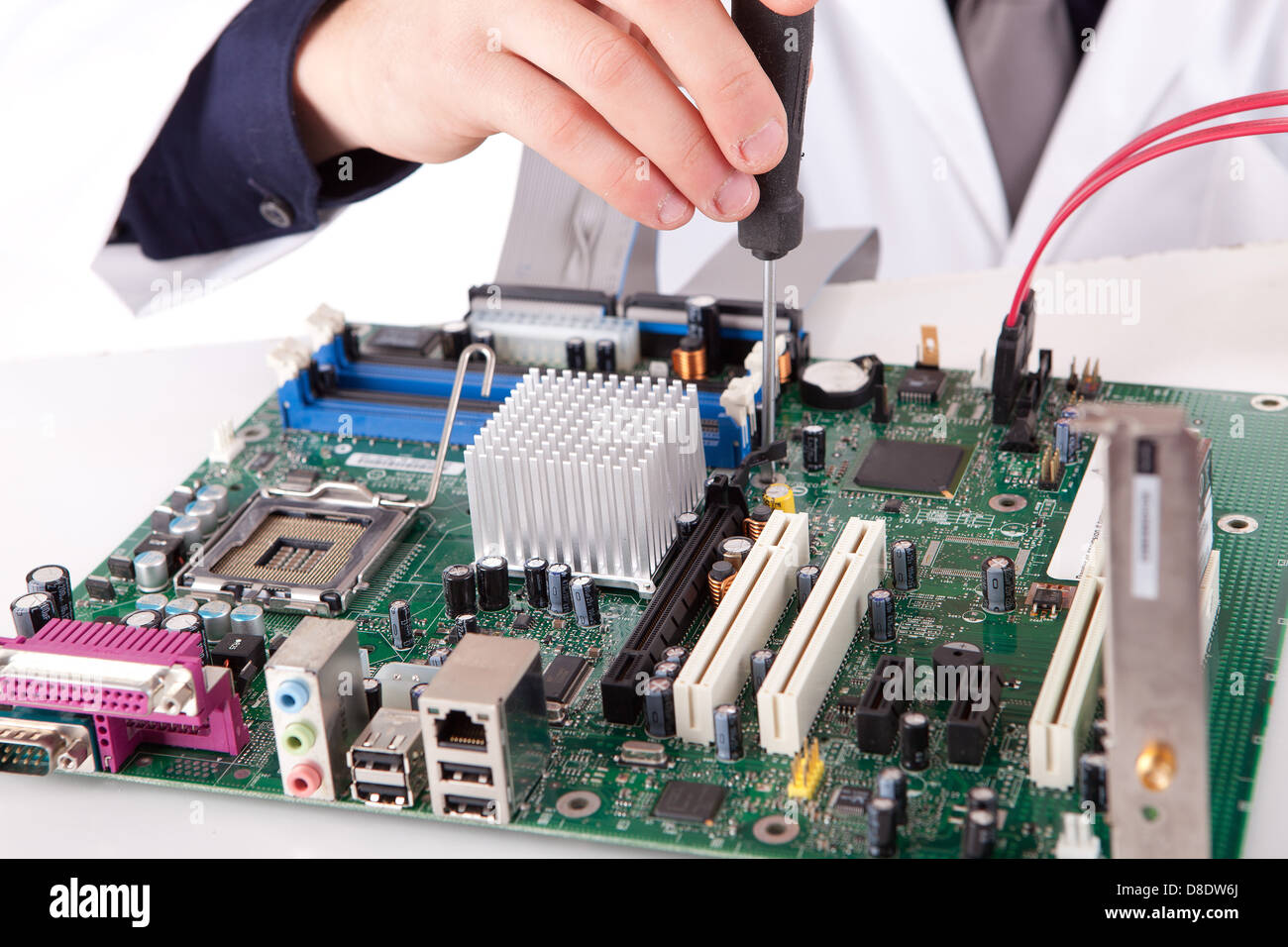 Computer engineer working on a old motherboard Stock Photo - Alamy