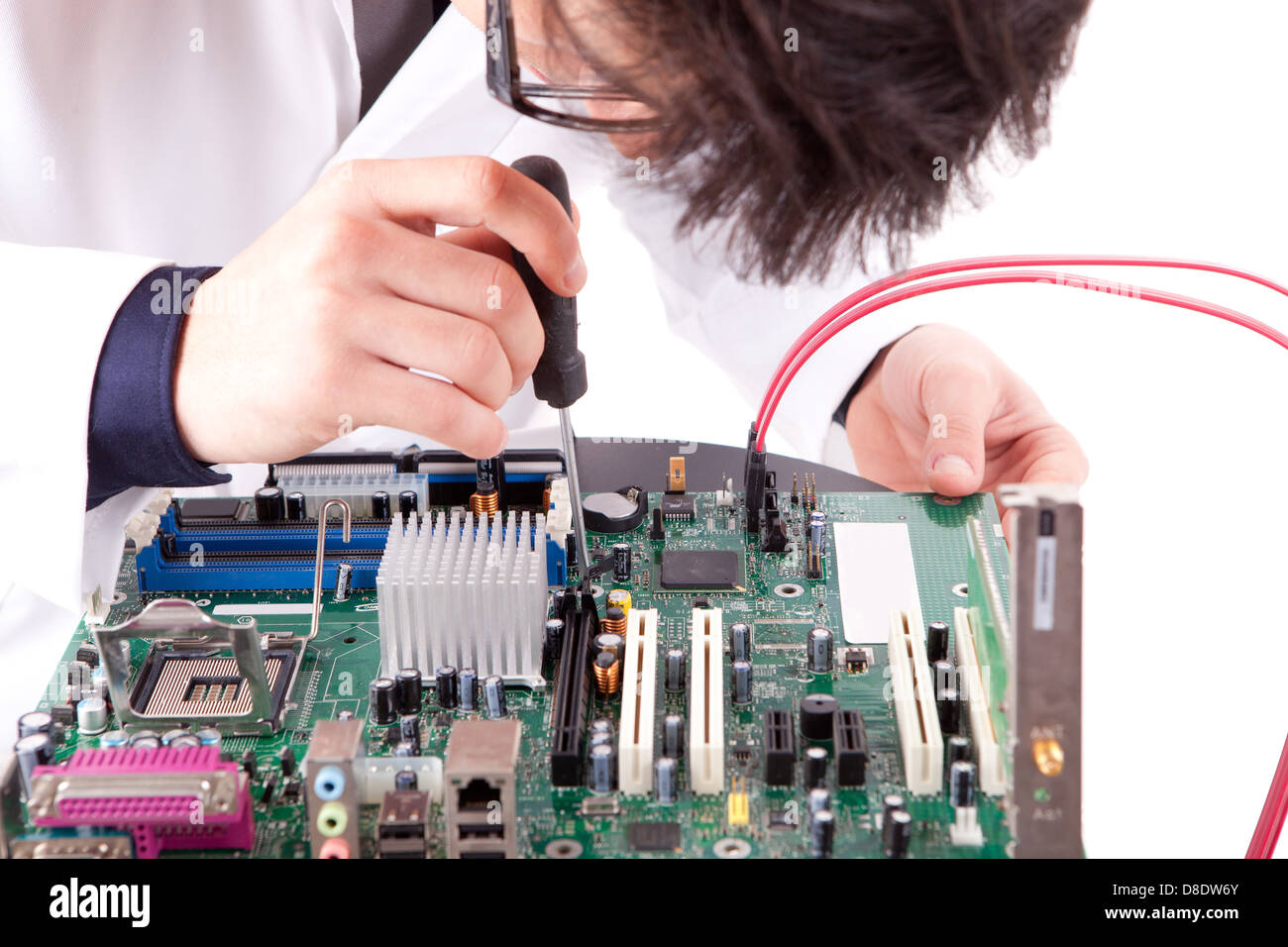 Computer engineer working on a old motherboard Stock Photo - Alamy