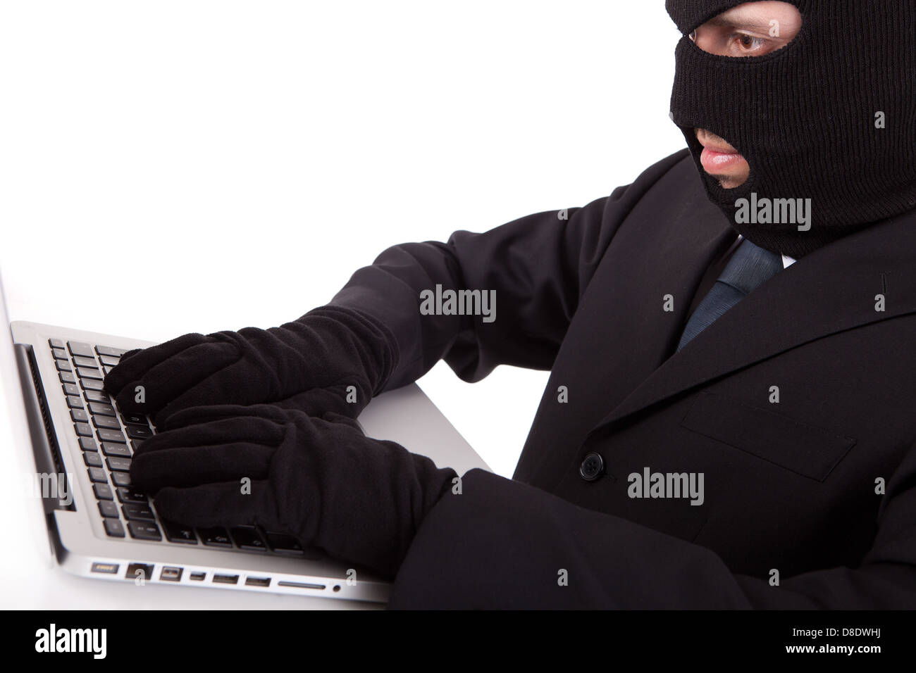 Computer hacker in suit and tie Stock Photo - Alamy