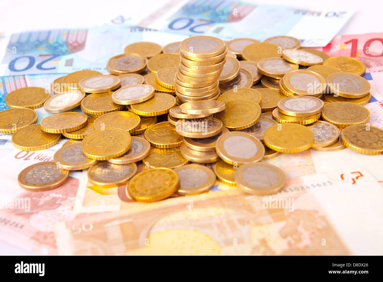 Pile of notes and coins Stock Photo - Alamy
