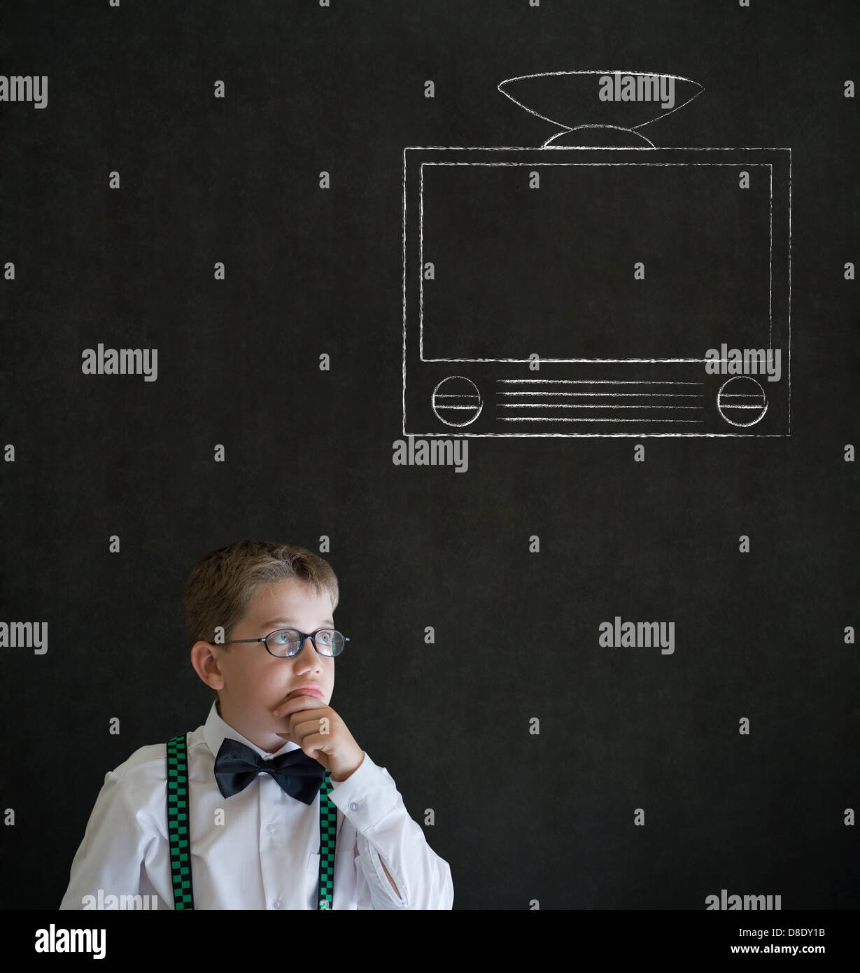 Thinking boy dressed up as business man with chalk tv television on ...