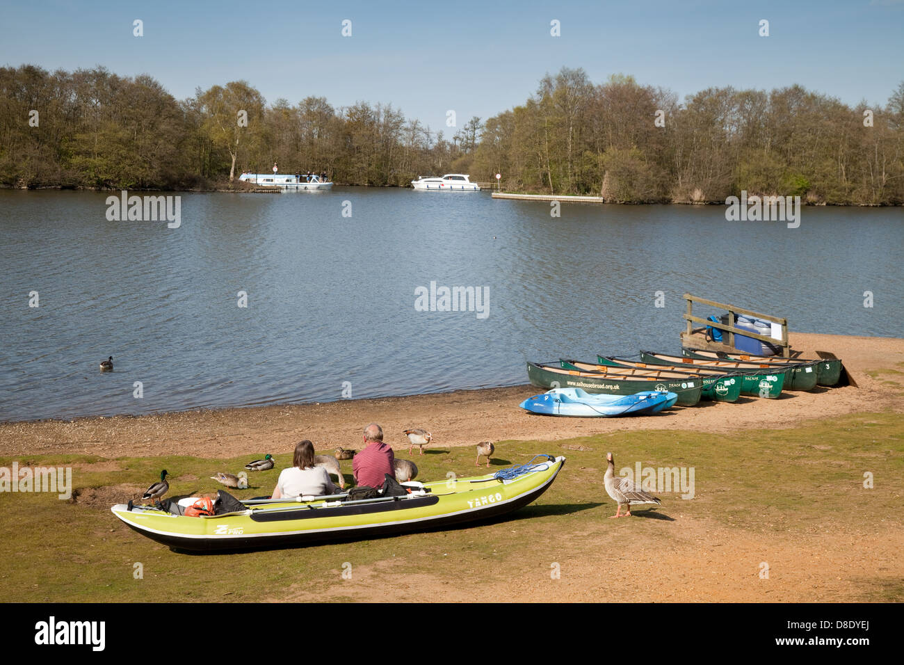 A couple enjoying the view over Salhouse Broad, Norfolk broads, East ...