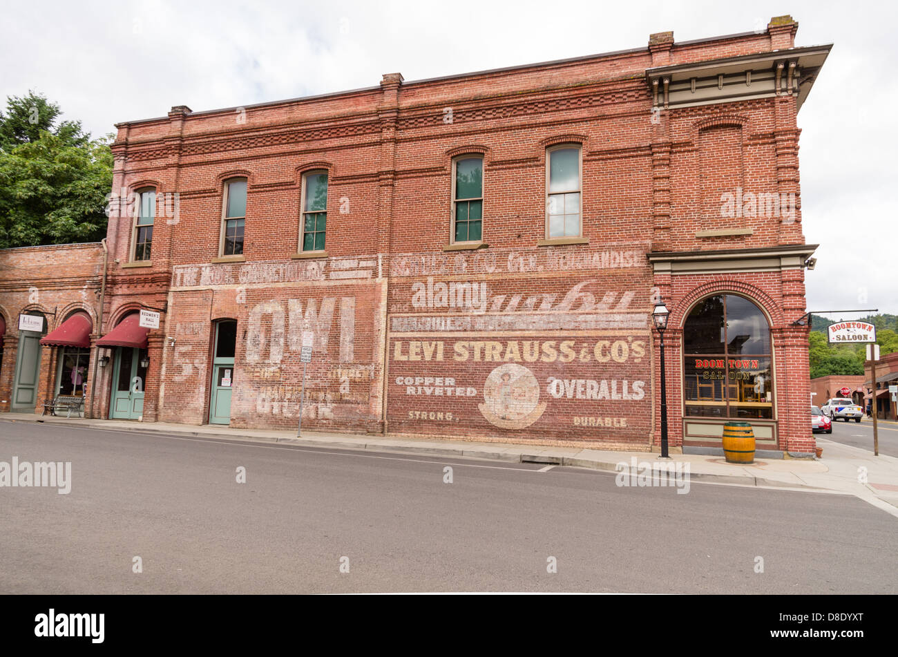 Jacksonville, Oregon, USA. Brick building with vintage advertising on ...
