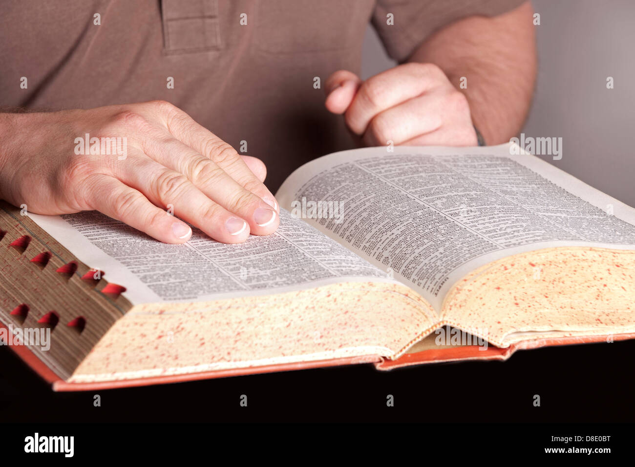 Hands holding book hi-res stock photography and images - Alamy