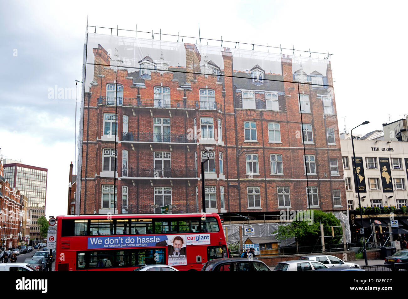 Covered facade of a building undergoing renovation Stock Photo - Alamy