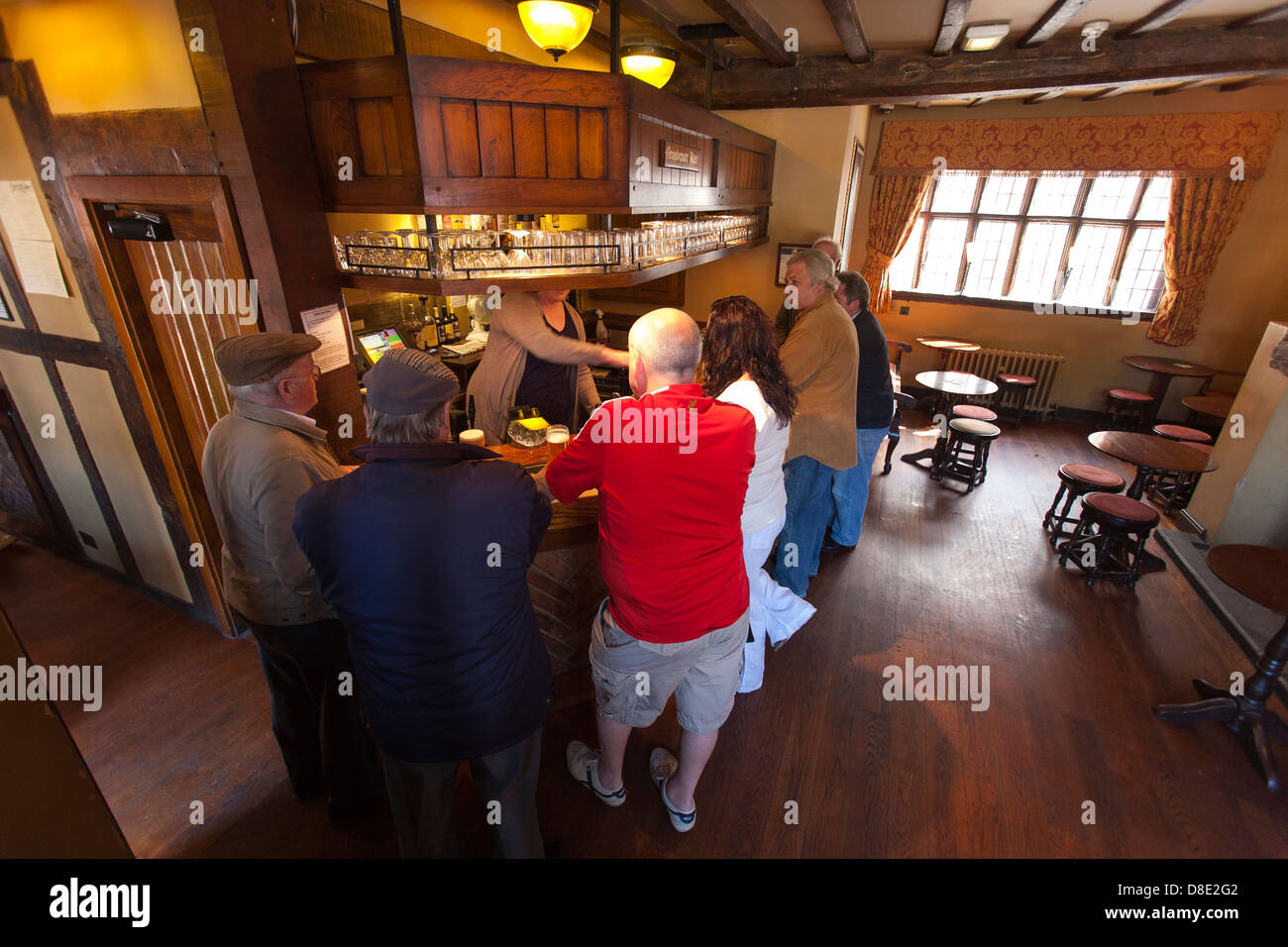 Regulars sits in the Falcon pub in Chester, reading a newspaper and ...
